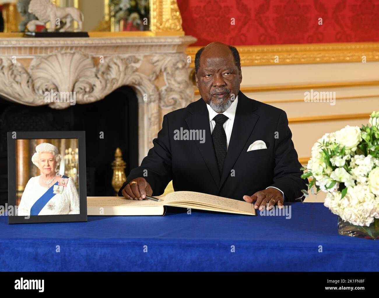 Former Mozambique President Joaquim Chissano signs a book of condolence ...