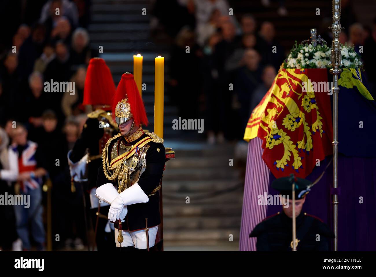 Royal guards stand guard where Queen Elizabeth II's flag-draped coffin ...