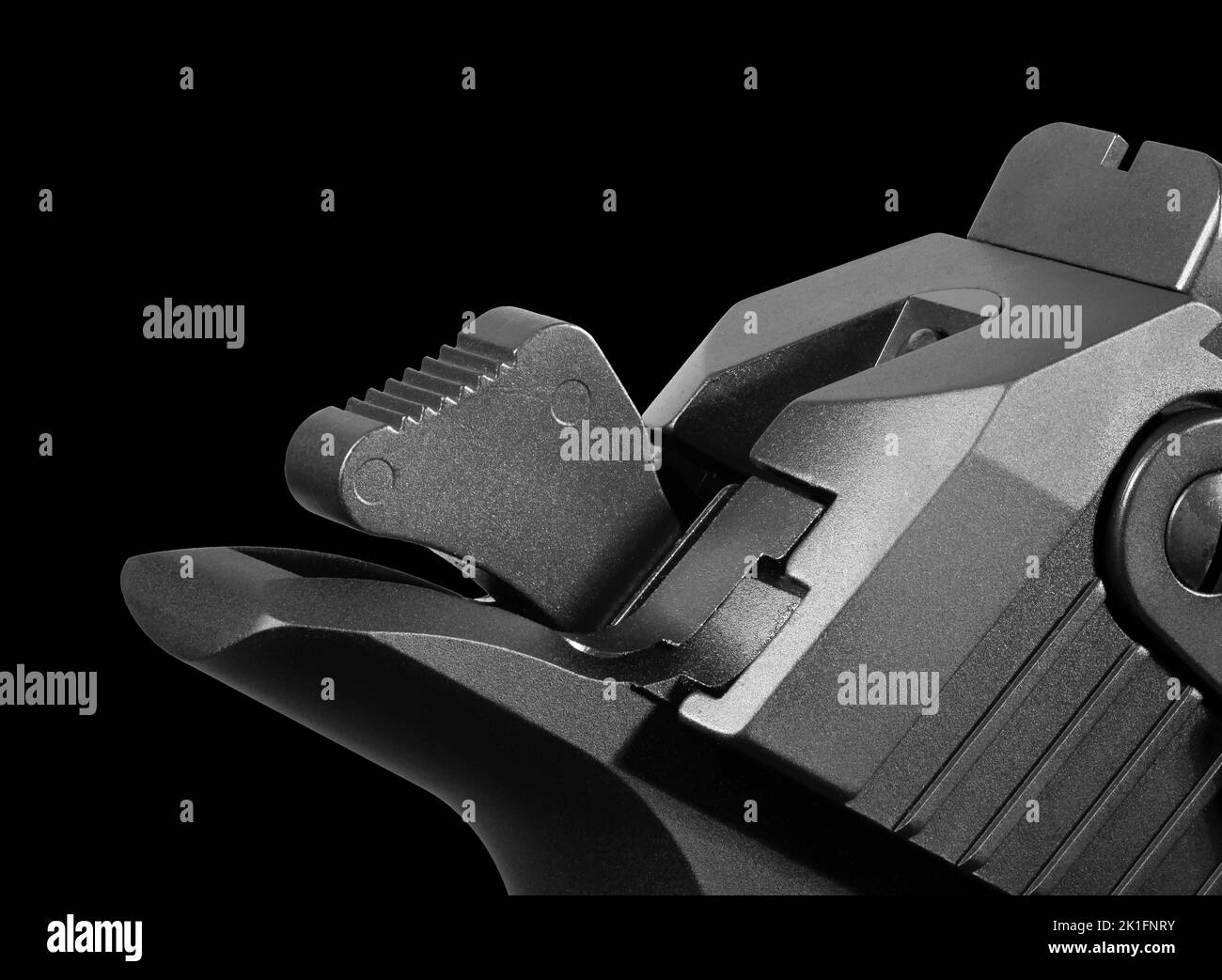 Hammer on a semi-automatic handgun on a black background Stock Photo ...