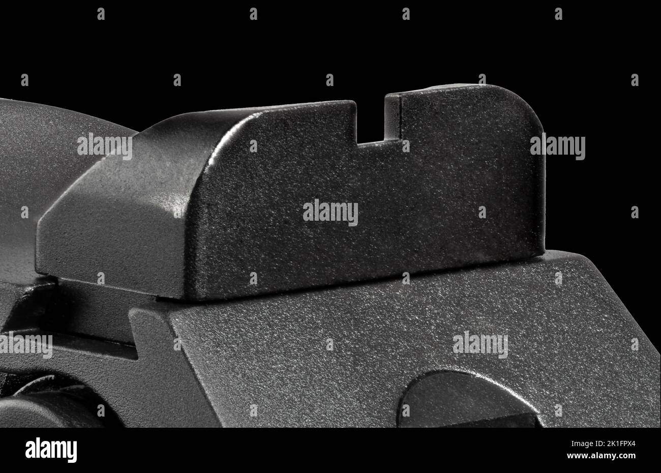 Rear sight on a handgun with a black background Stock Photo - Alamy