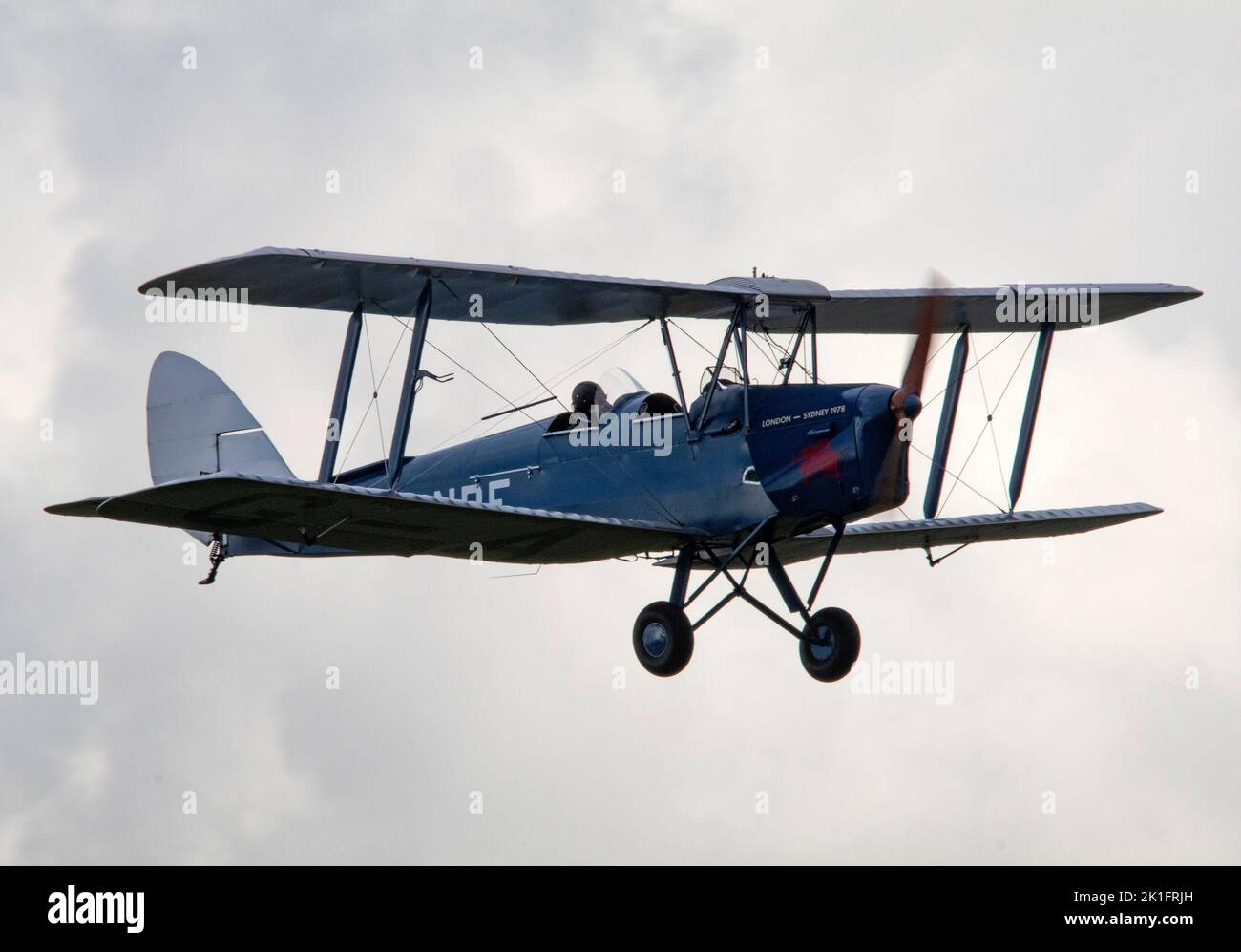 Tiger Moth from the Tiger 9 display team landing at dusk, after it's ...