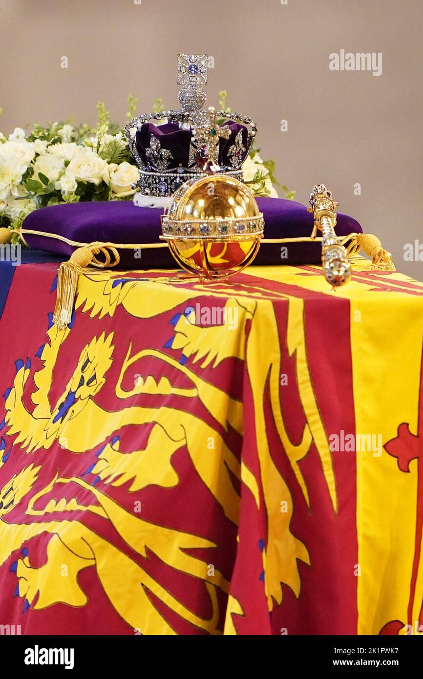 The coffin of Queen Elizabeth II, draped in the Royal Standard with the ...
