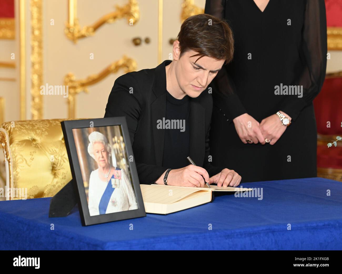 Serbian Prime Minister Ana Brnabic signs a book of condolence at ...
