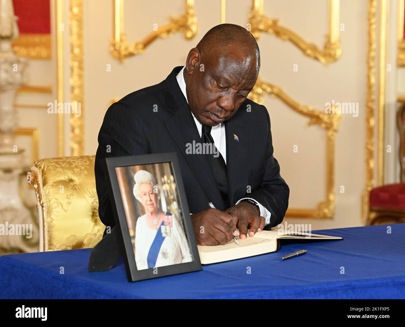 South African President Cyril Ramaphosa signs a book of condolence at ...