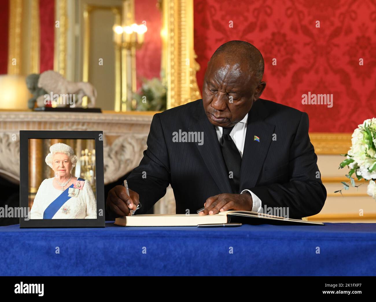 South African President Cyril Ramaphosa signs a book of condolence at ...