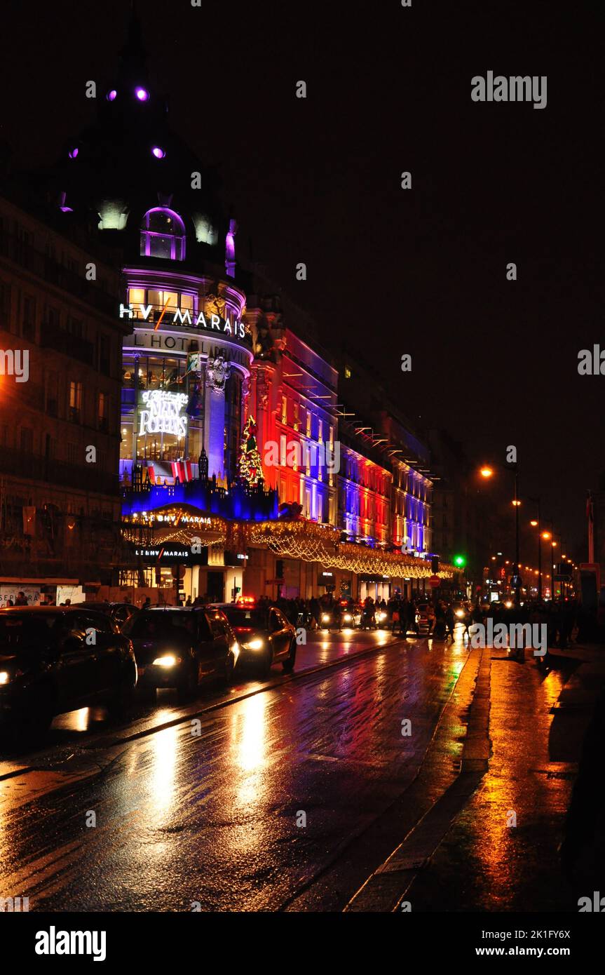 Colorfully illuminated boulevard in Paris at night, France Stock Photo ...