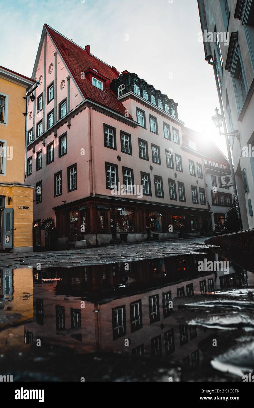 Reflections in a puddle of the colourful facades from Tallinns old town ...