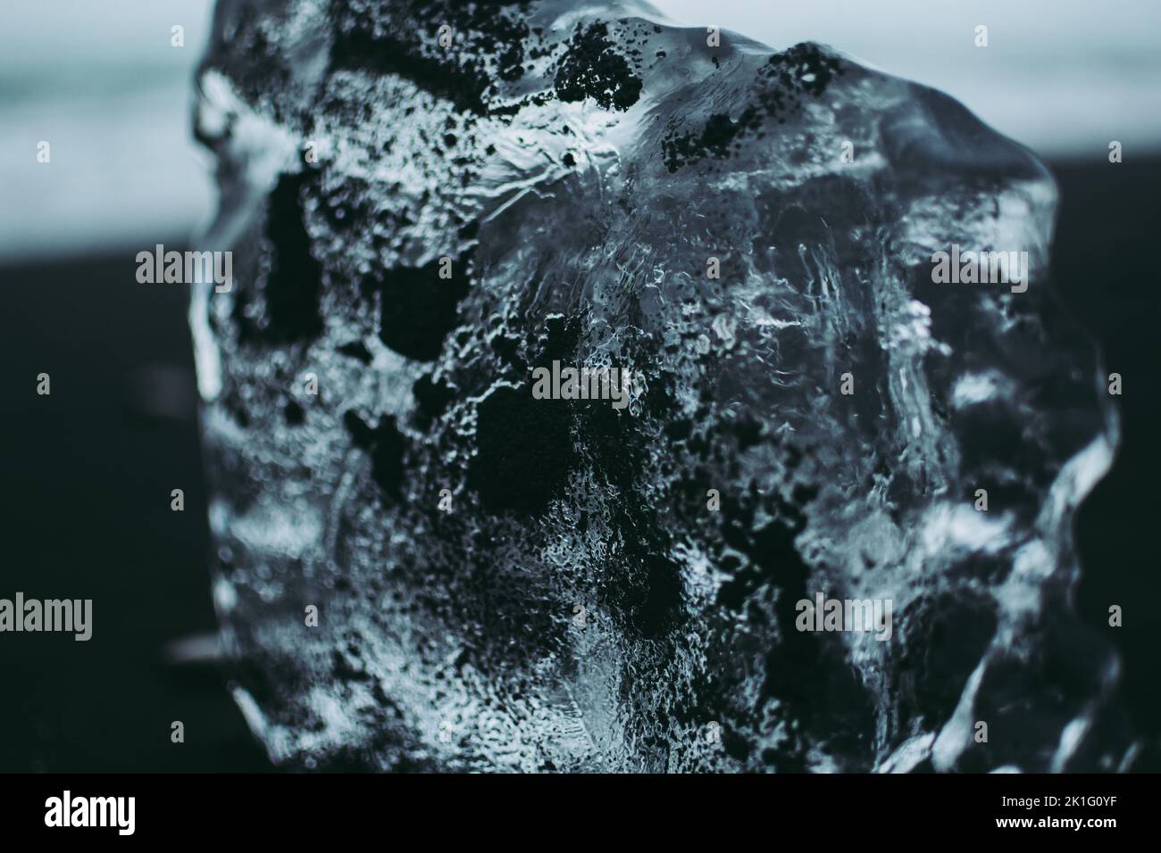 Close-up of glacier covered with black soil. Transparent blue ice Stock ...