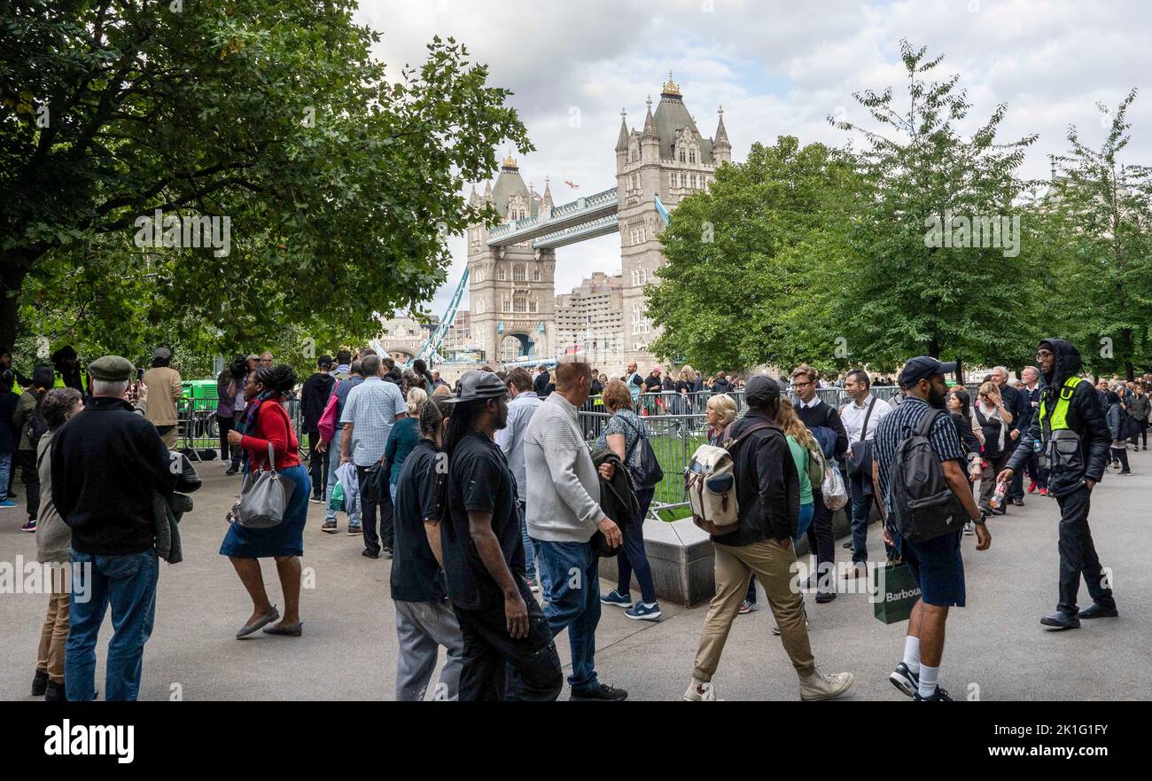 Members of the public queue back to tower bridge to pay their respects ...