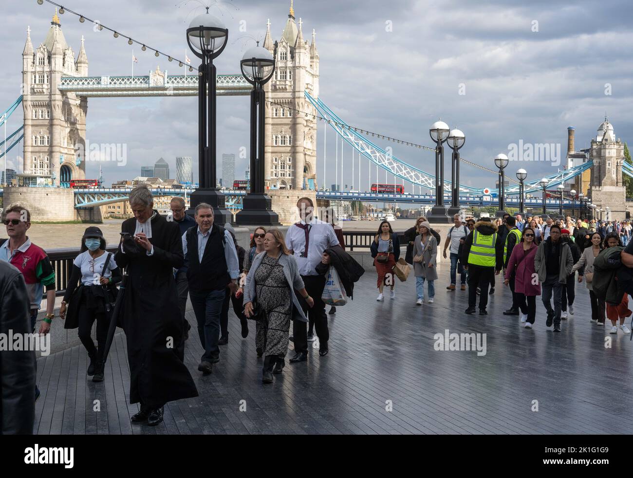 Members of the public queue back to tower bridge to pay their respects ...