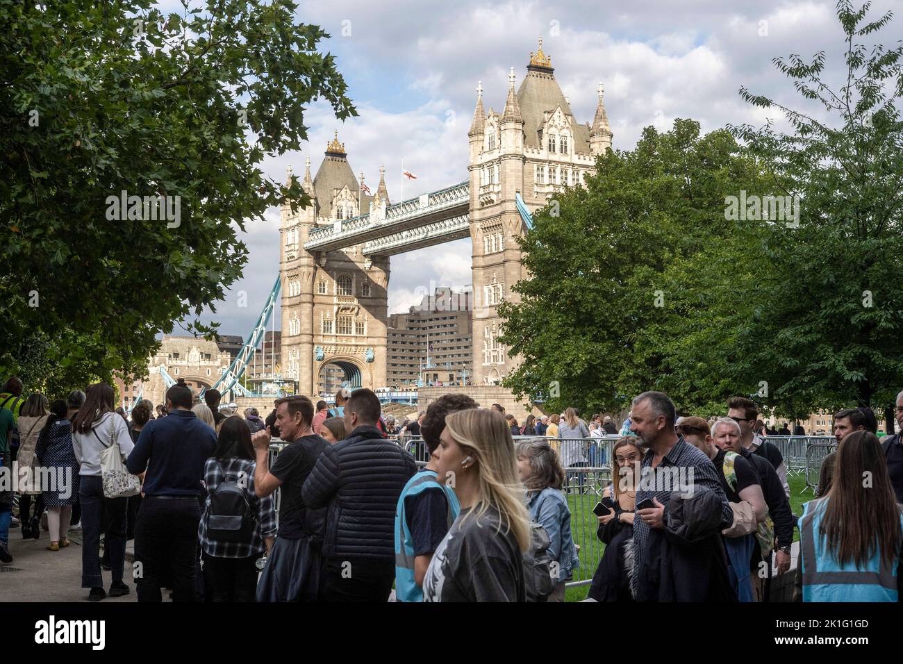 Members of the public queue back to tower bridge to pay their respects ...