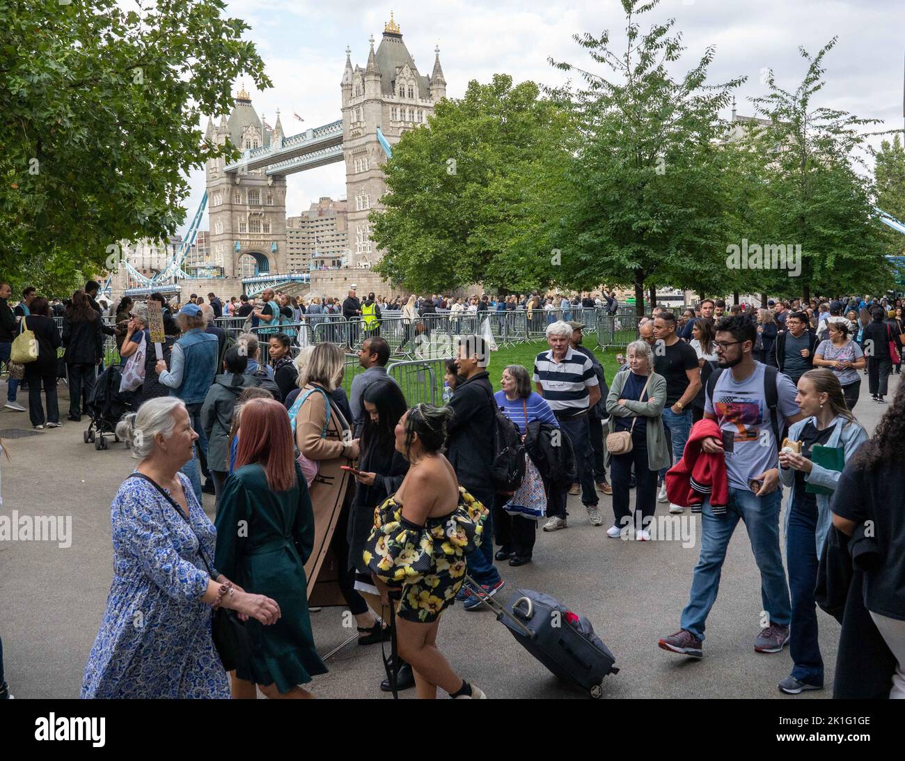 Members of the public queue back to tower bridge to pay their respects ...