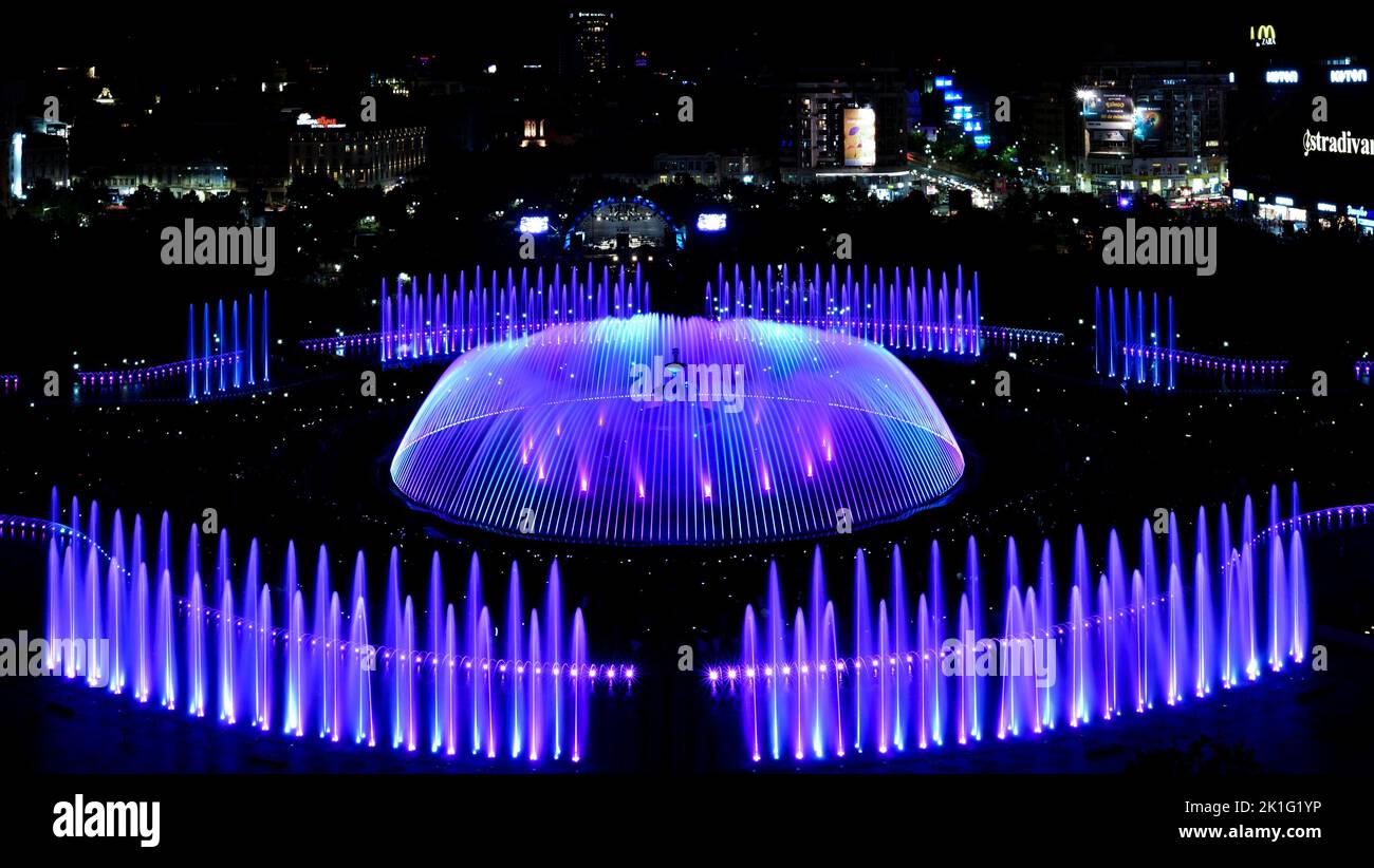 A charming view of Downtown Bucharest fountains with night illumination ...