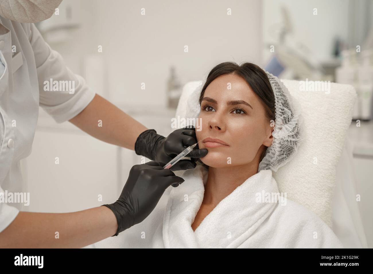 Cosmetologist Makes Injections To Increase Lips And Anti Wrinkles Of