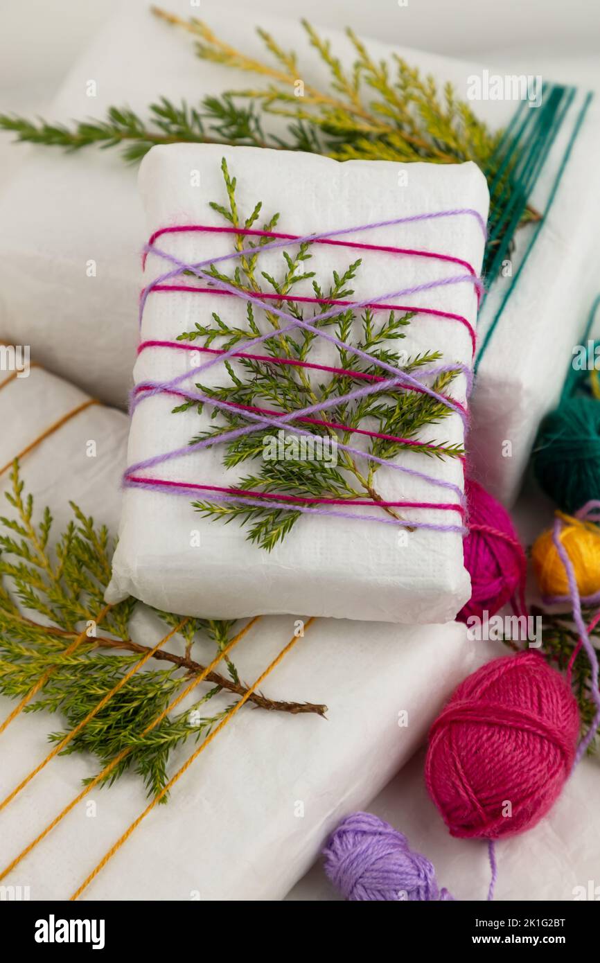 Original gift wrapping idea for Christmas. Recycled paper, colored wool ...