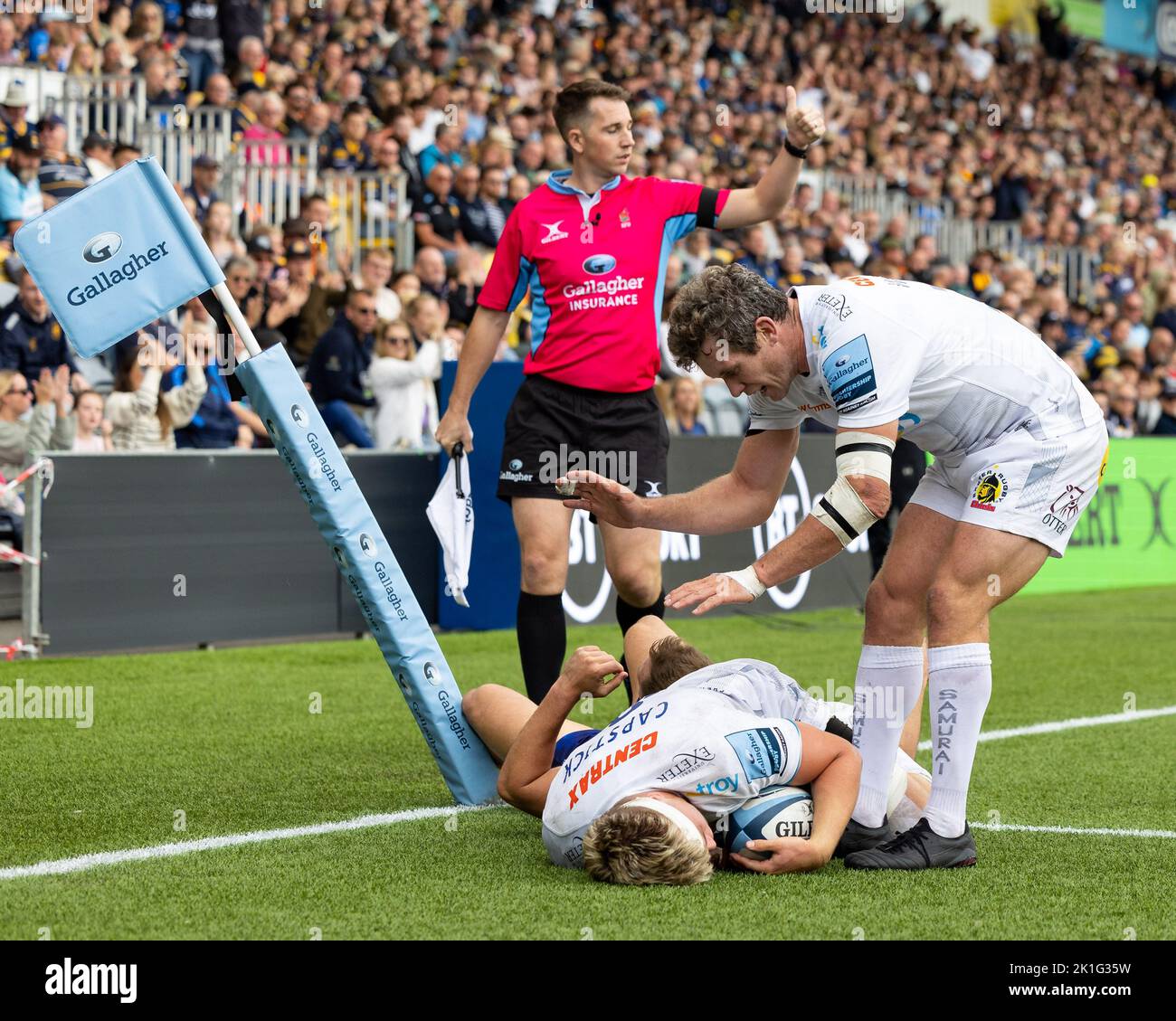 Richard Capstick of Exeter Chiefs is congratulated by Ian Whitten of ...