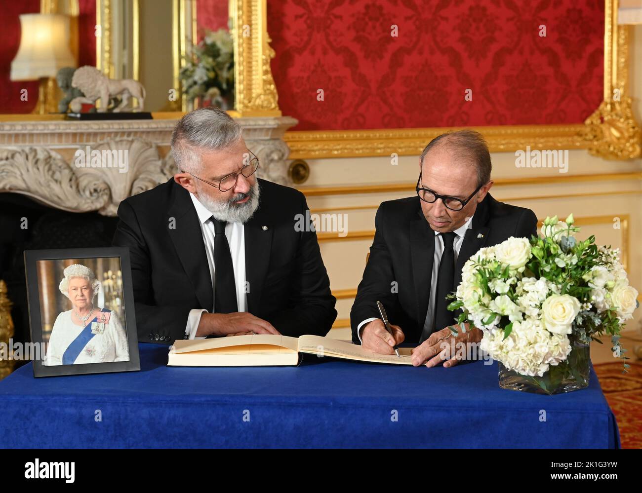 Captains Regent Paolo Rondelli (left) and Oscar Mina sign a book of ...
