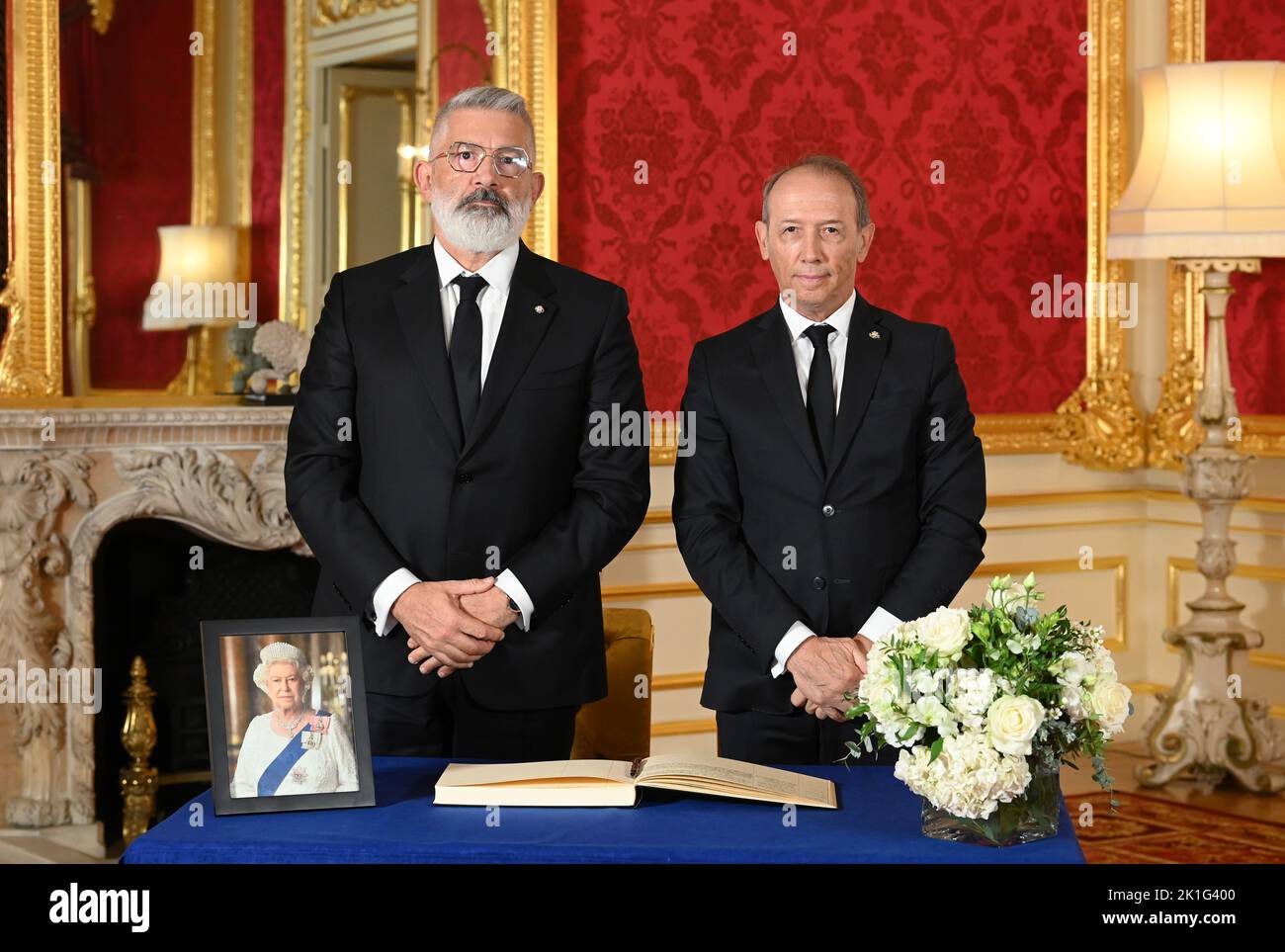 (L-R) Captains Regent Paolo Rondelli and Oscar Mina sign a book of ...