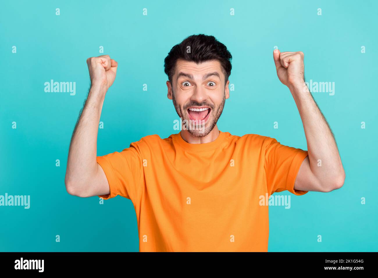 Closeup photo of young attractive handsome funny man excited fists up ...