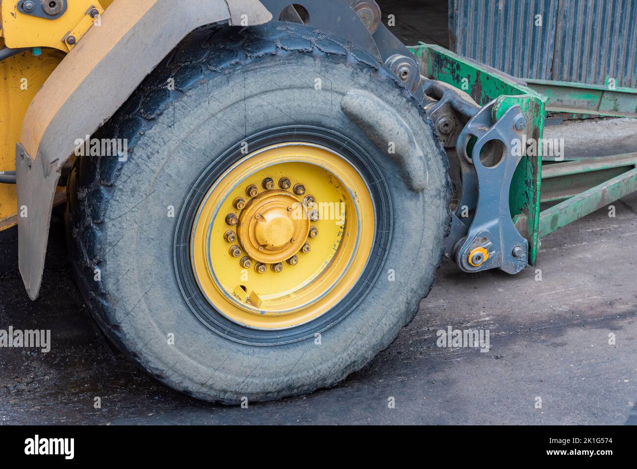 Huge wheel of heavy machinery with a balloon or pomp on its side Stock ...