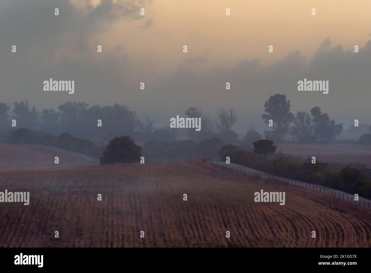 Autumn landscape of farm fields, trees and a highway that crosses ...