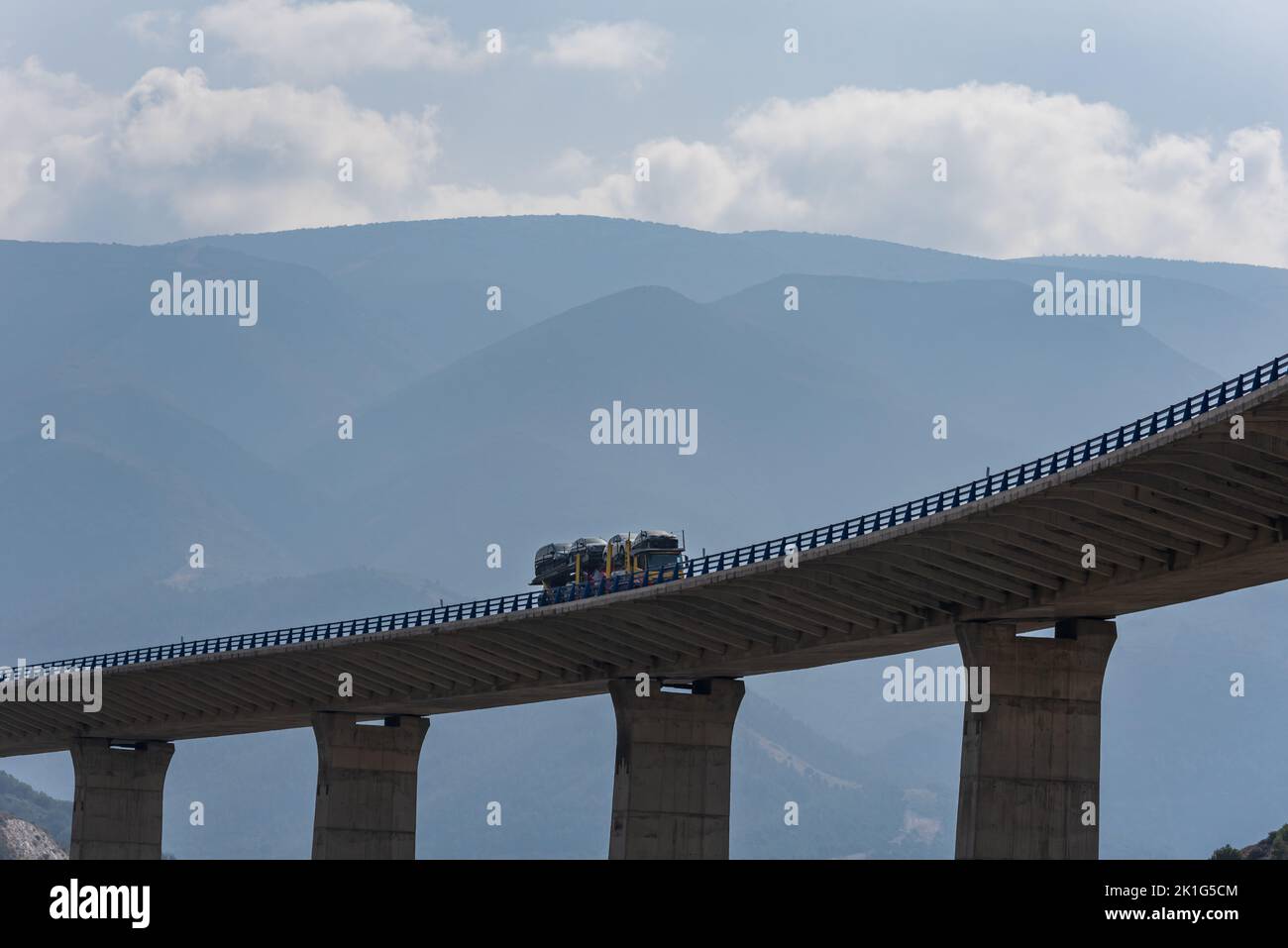 Car transporter driving along a viaduct Stock Photo - Alamy