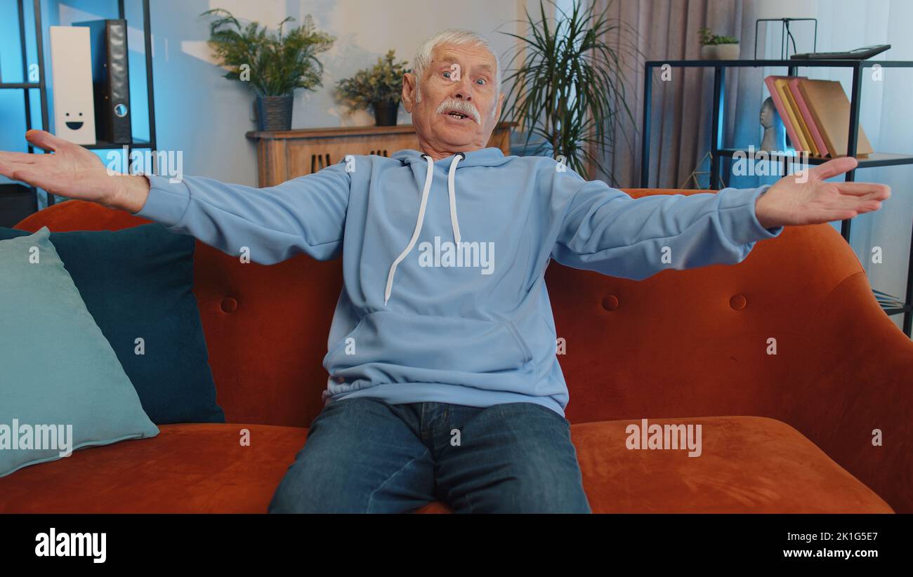 What. Why. Senior old grandfather raising hands in indignant expression ...