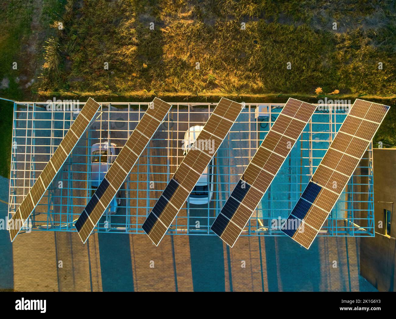 Aerial view above innovative solar panels located on a car parking, lot ...