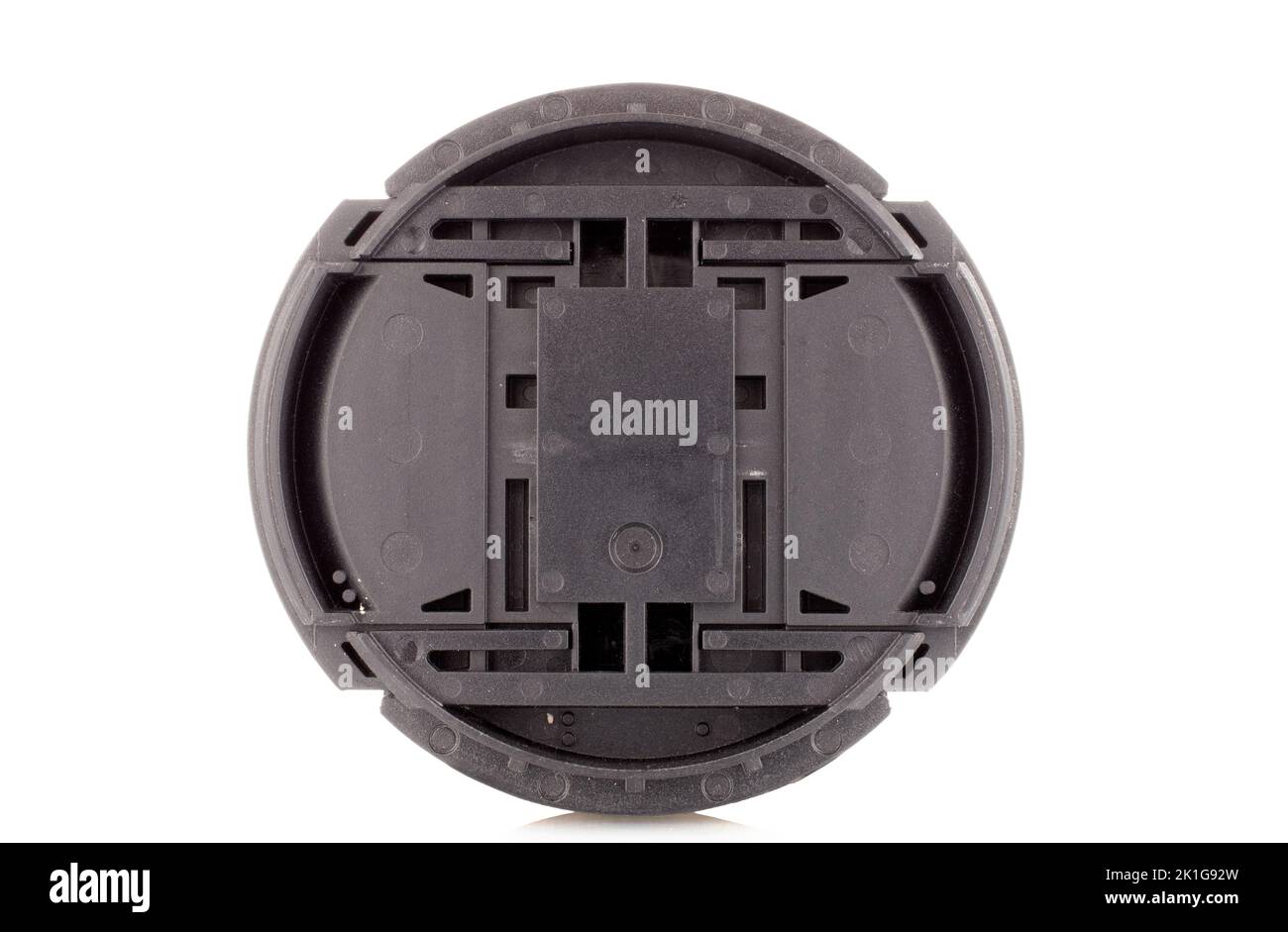 One plastic cap on a camera lens, macro, isolated on a white background ...