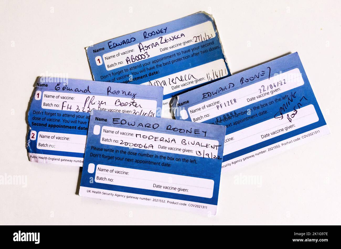 Four cards that mark Covid-19 vaccinations -- Astra Zeneca, Pfizer, and ...