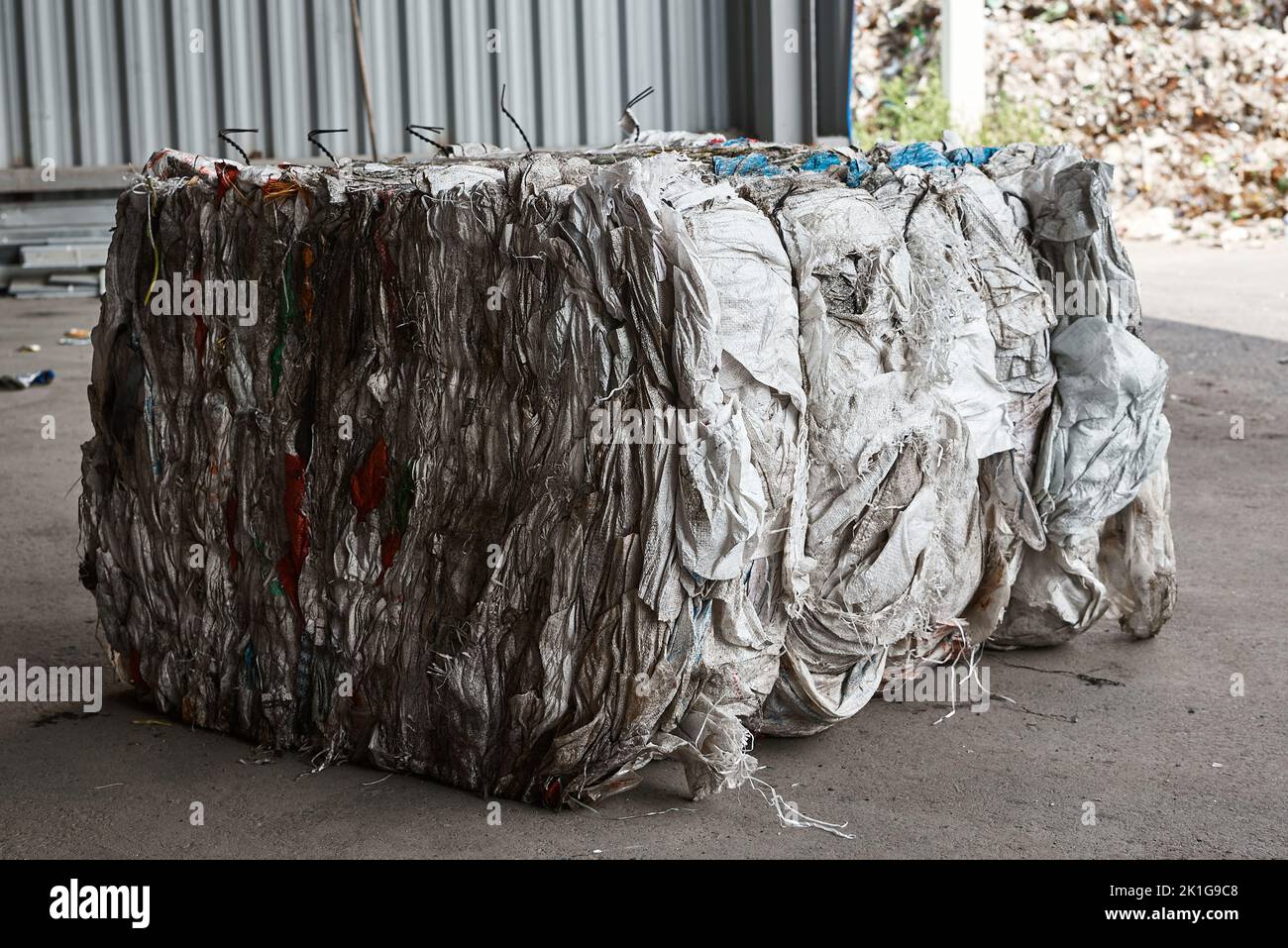 Block of pressed plastic material at recycling plant storage Stock ...