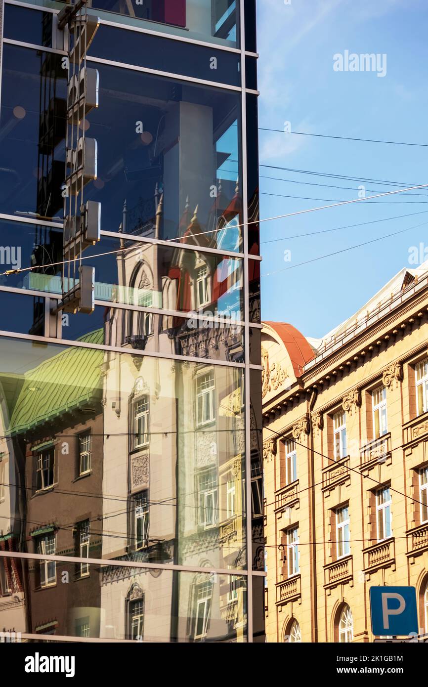 A transparent building in the middle of the city center with many ...
