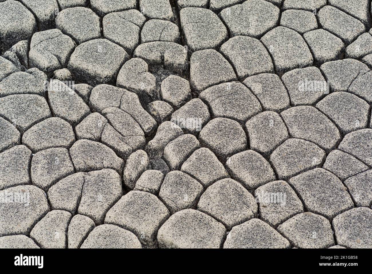 natural stone background, the remains of lava basalt columns form a ...