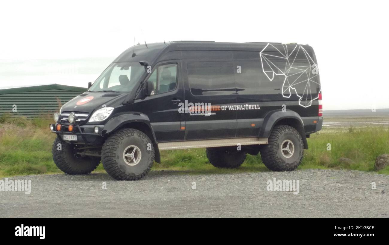 A closeup shot of a Mercedes Sprinter van in off-road version with ...