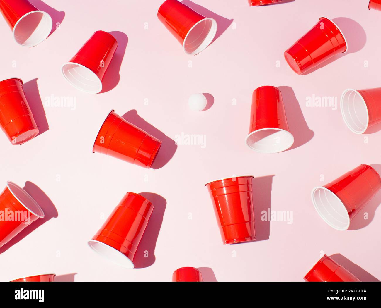 Red plastic beer pong cups on pink background. Flat lay Stock Photo - Alamy