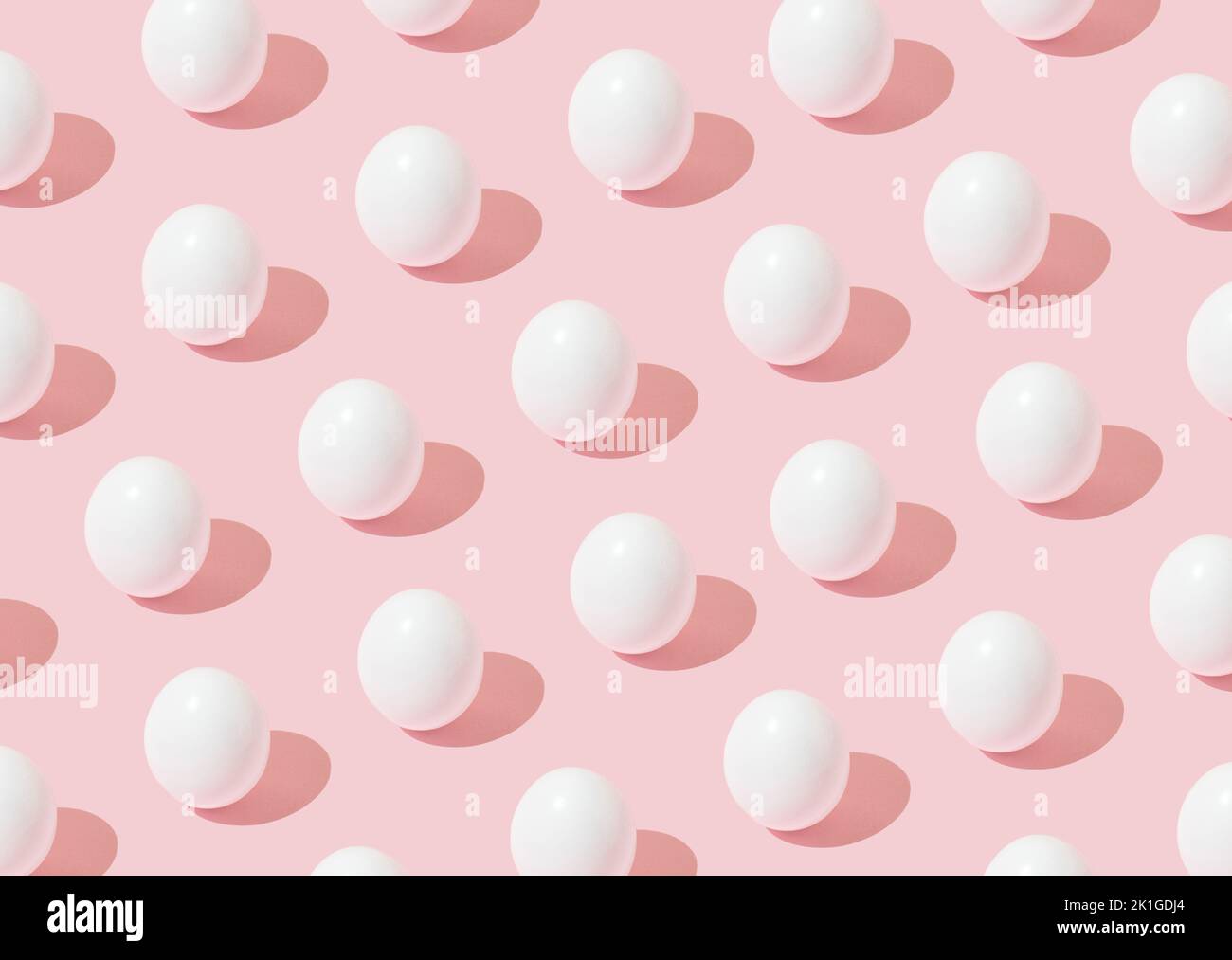 Easter background pattern with white eggs on pink background. Minimal ...