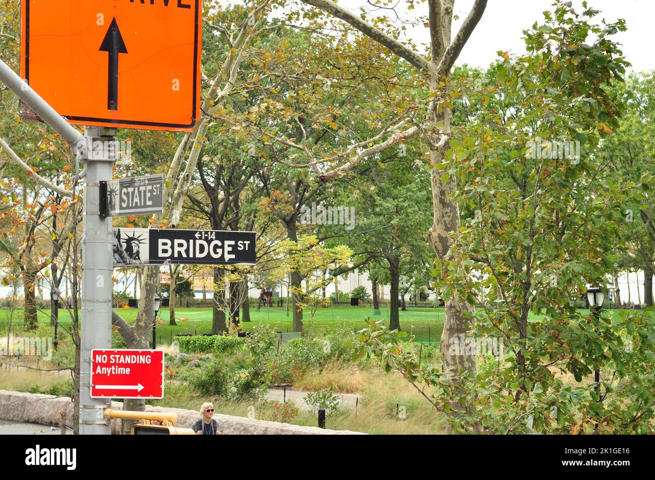 several Street signs with Brooklyn Bridge, Statue of Liberty, etc. in ...