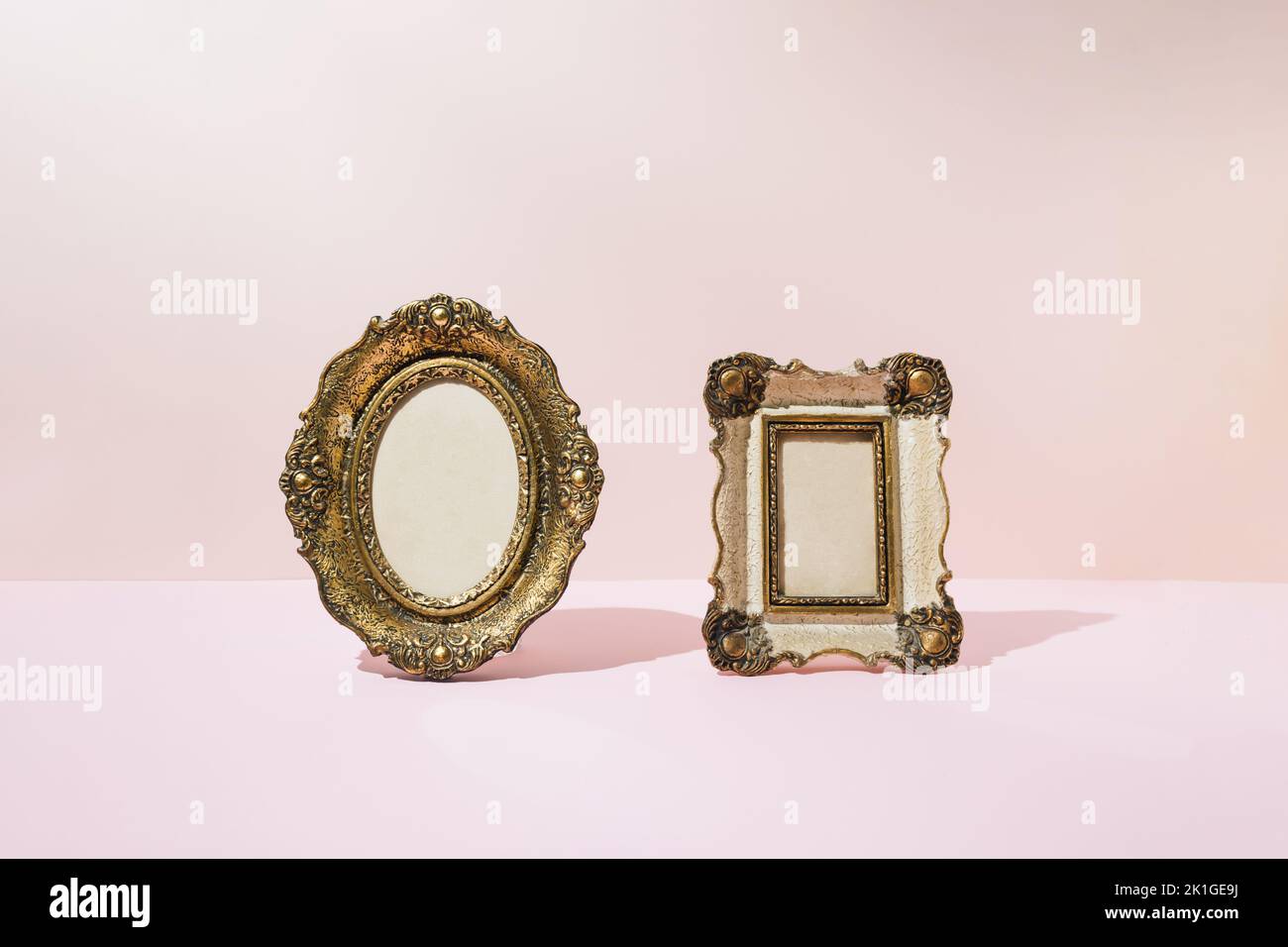 Old vintage empty picture frames on pink background. Copy space Stock ...