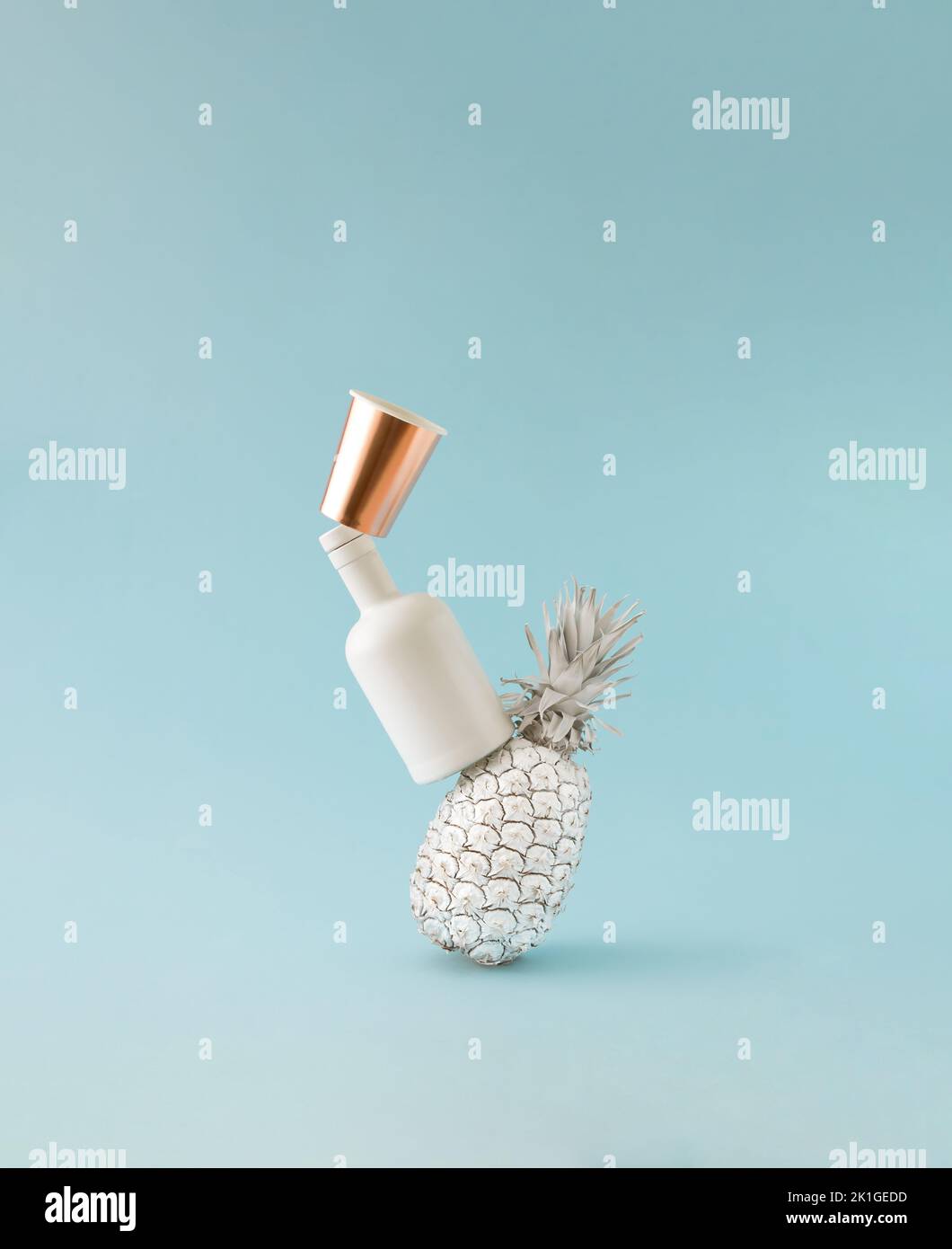 Symbol of balance with white pineaple, drinking bottle and golden paper ...
