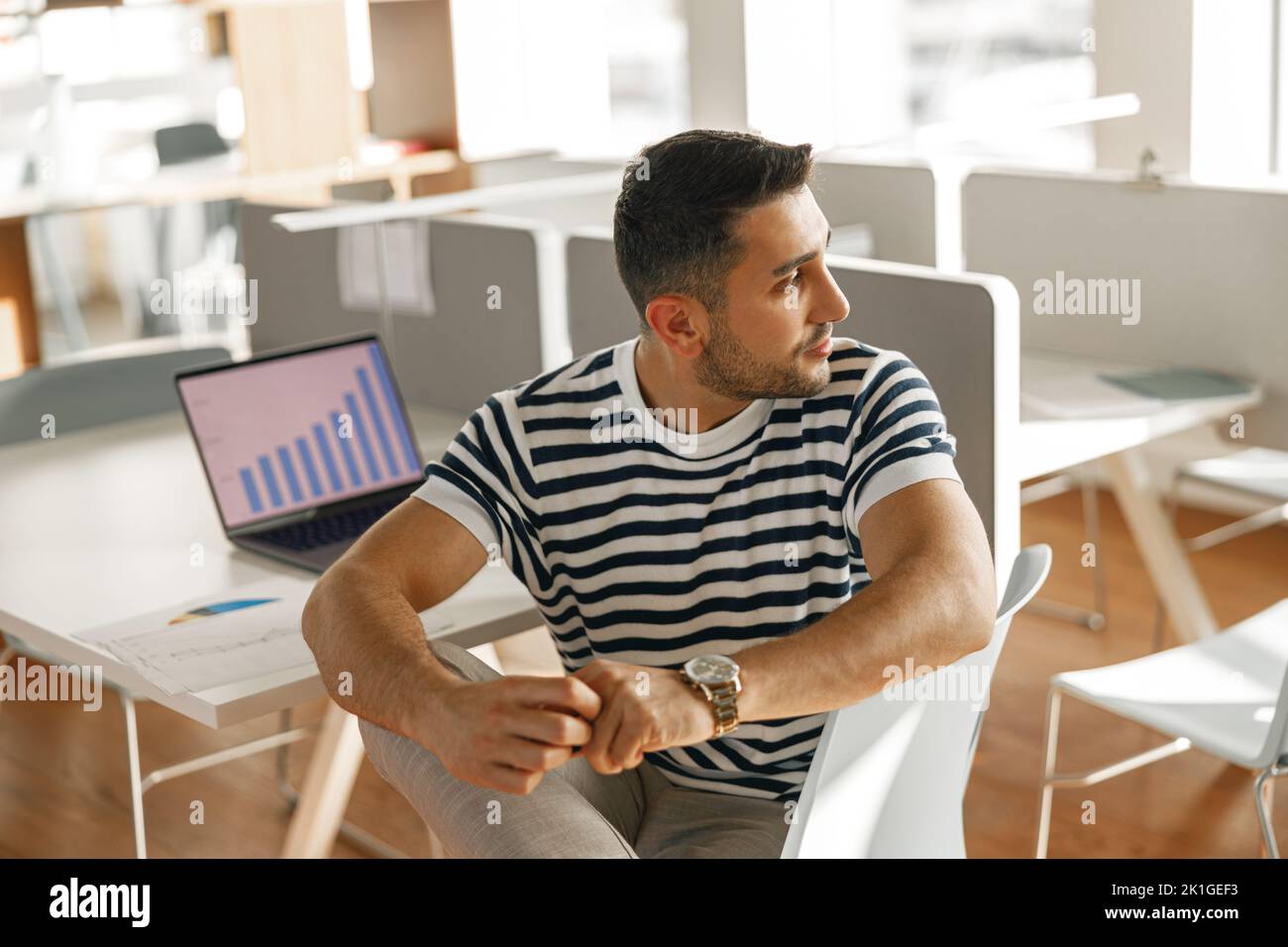 Businessman in casual clothes working laptop while sitting in modern ...