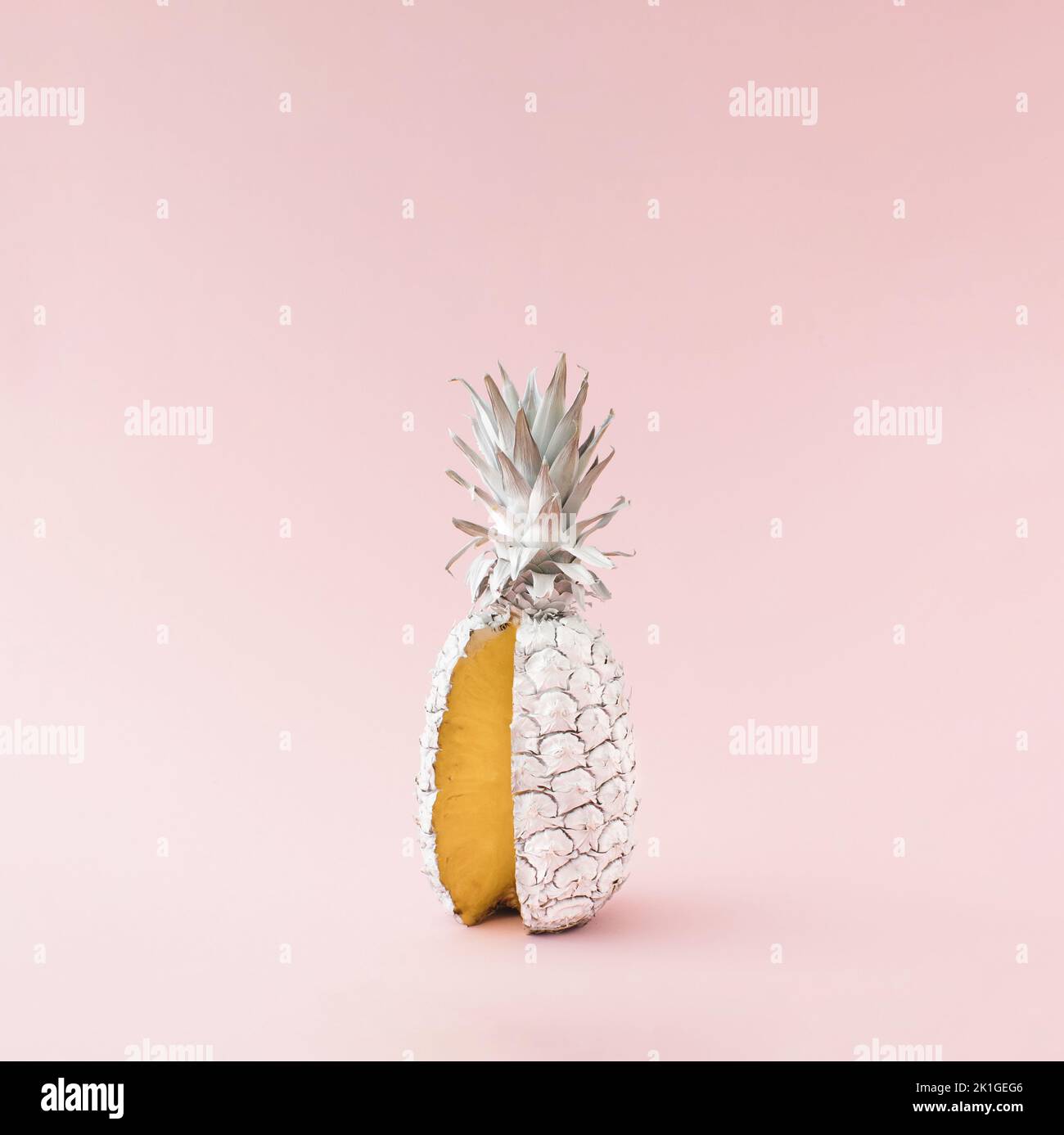 Fresh pineapple colored in white with one cut slice. Minimal summer ...