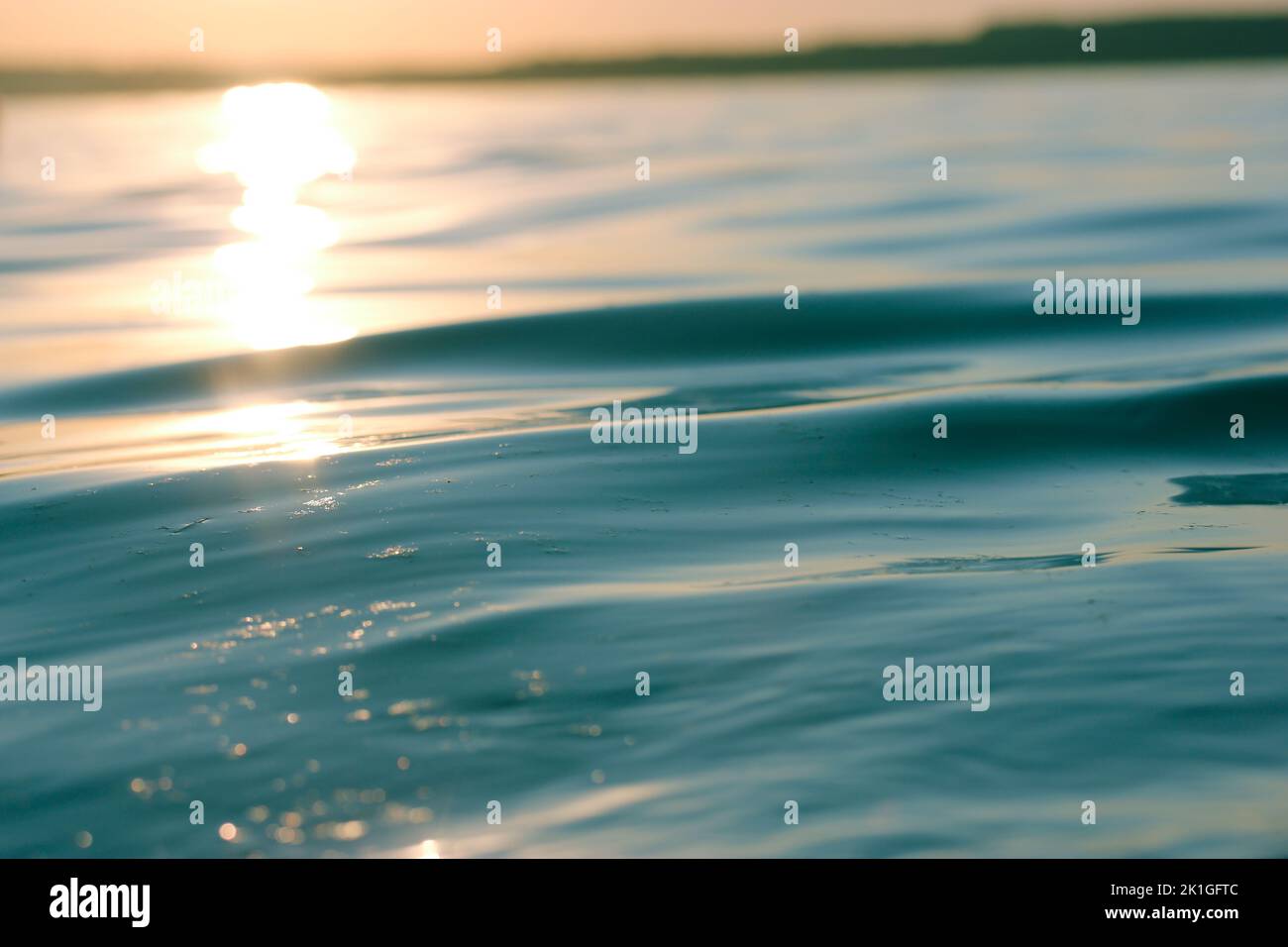 Calm blue water surface and a horizon view. Soft smooth waves backdrop ...