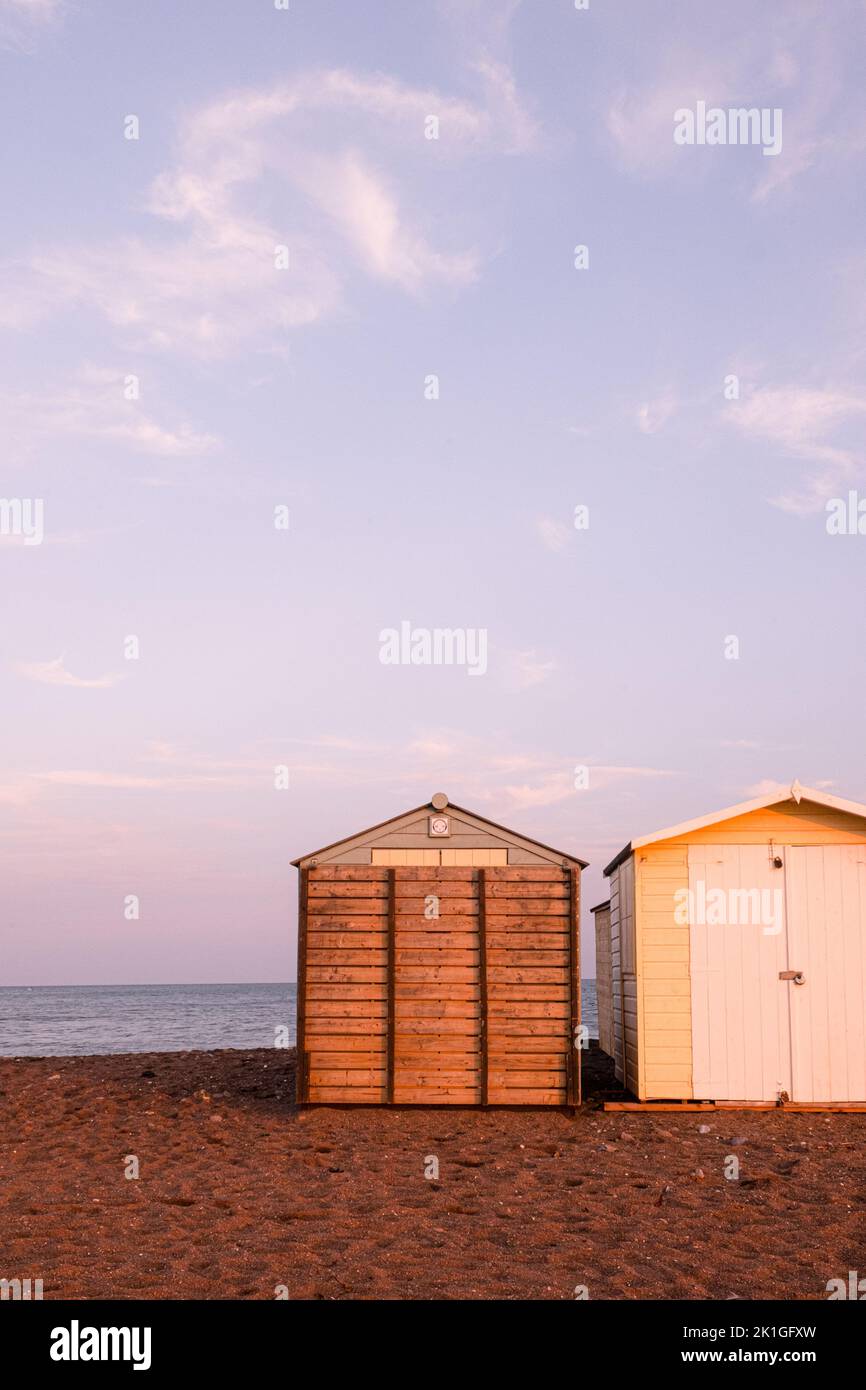 Beach huts at sunset on Teignmouth's 'back beach' Stock Photo - Alamy