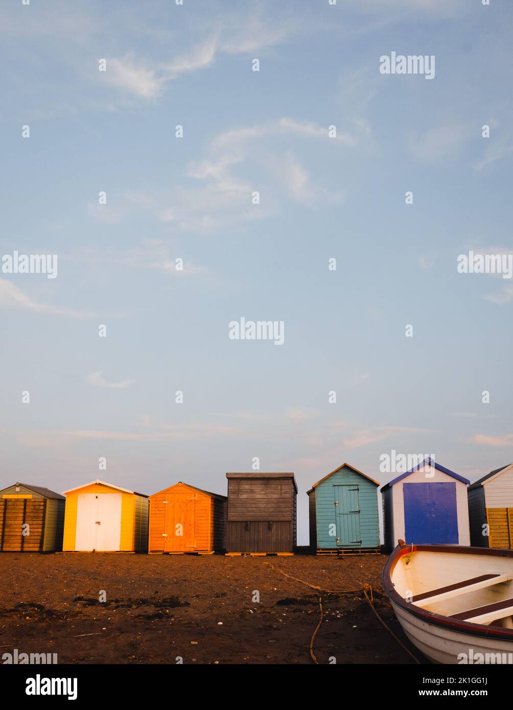 Beach huts at sunset on Teignmouth's 'back beach' Stock Photo - Alamy