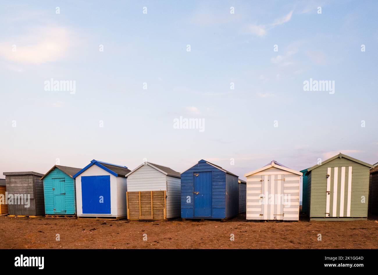 Beach huts at sunset on Teignmouth's 'back beach' Stock Photo - Alamy