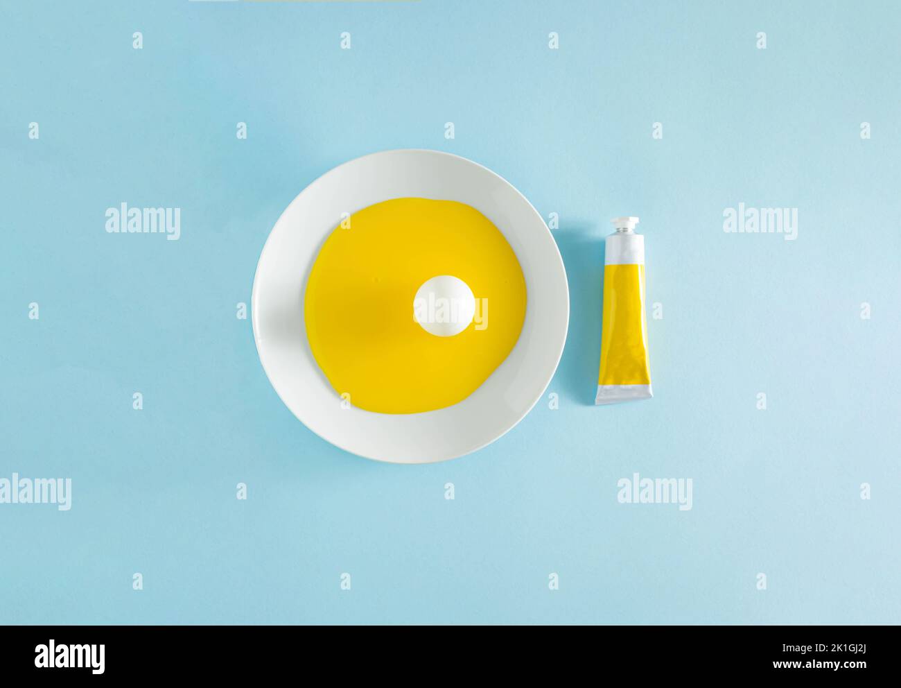 Artistic inverted egg, with yellow egg white and white yolk on a white ...