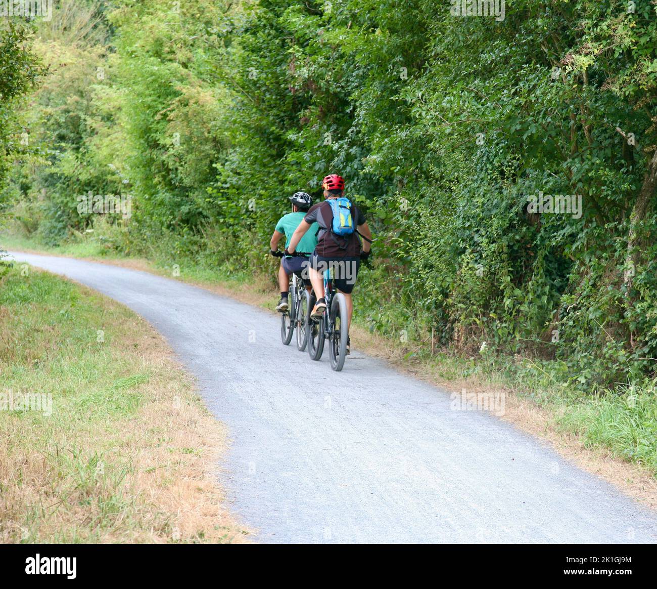 Cyclists on the towpath, River Vire, Saint-Lo, Manche, Normandy, France ...