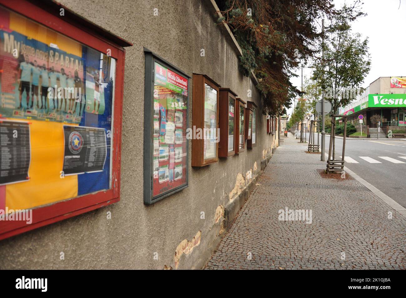 An old wall with info boxes and showcases on a street in Prague, Czech ...