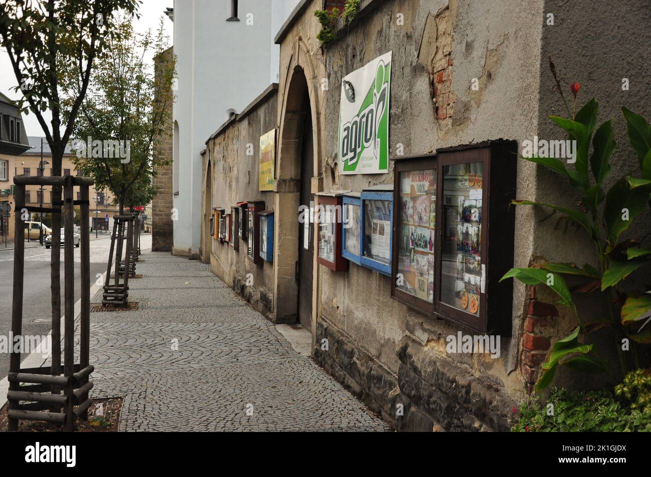 An old wall with showcases and info boxes on a street in Prague, Czech ...
