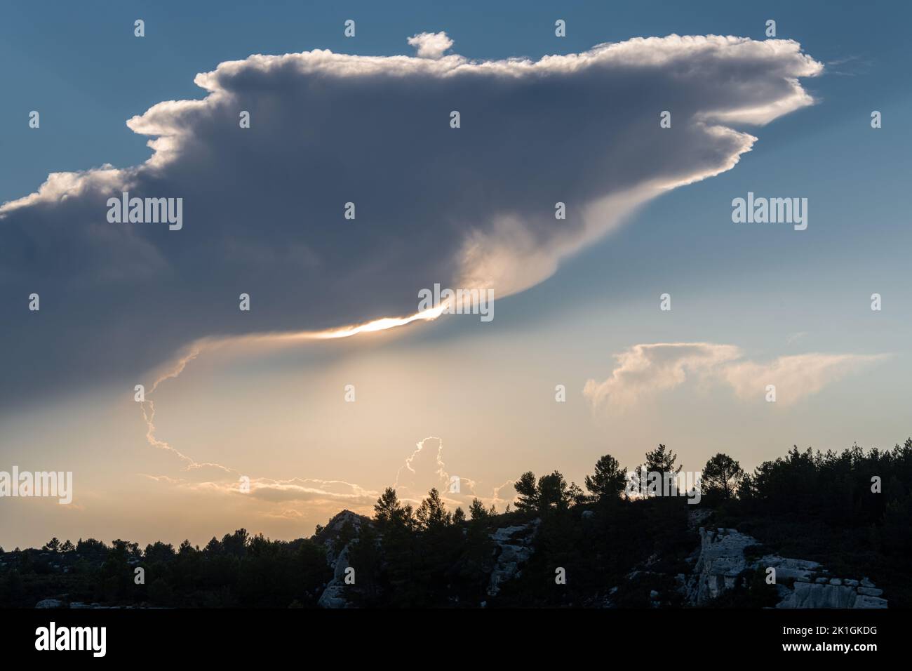 The Sun sets behind a cloud in Les Baux-de-Provence, South Of France Stock Photo - Alamy